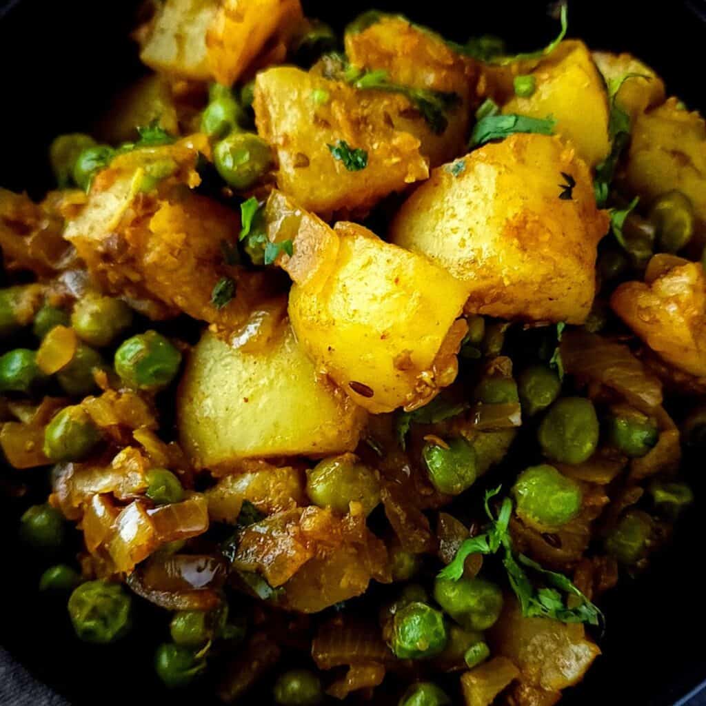 Spicy aloo matar dry-curried potatoes and peas